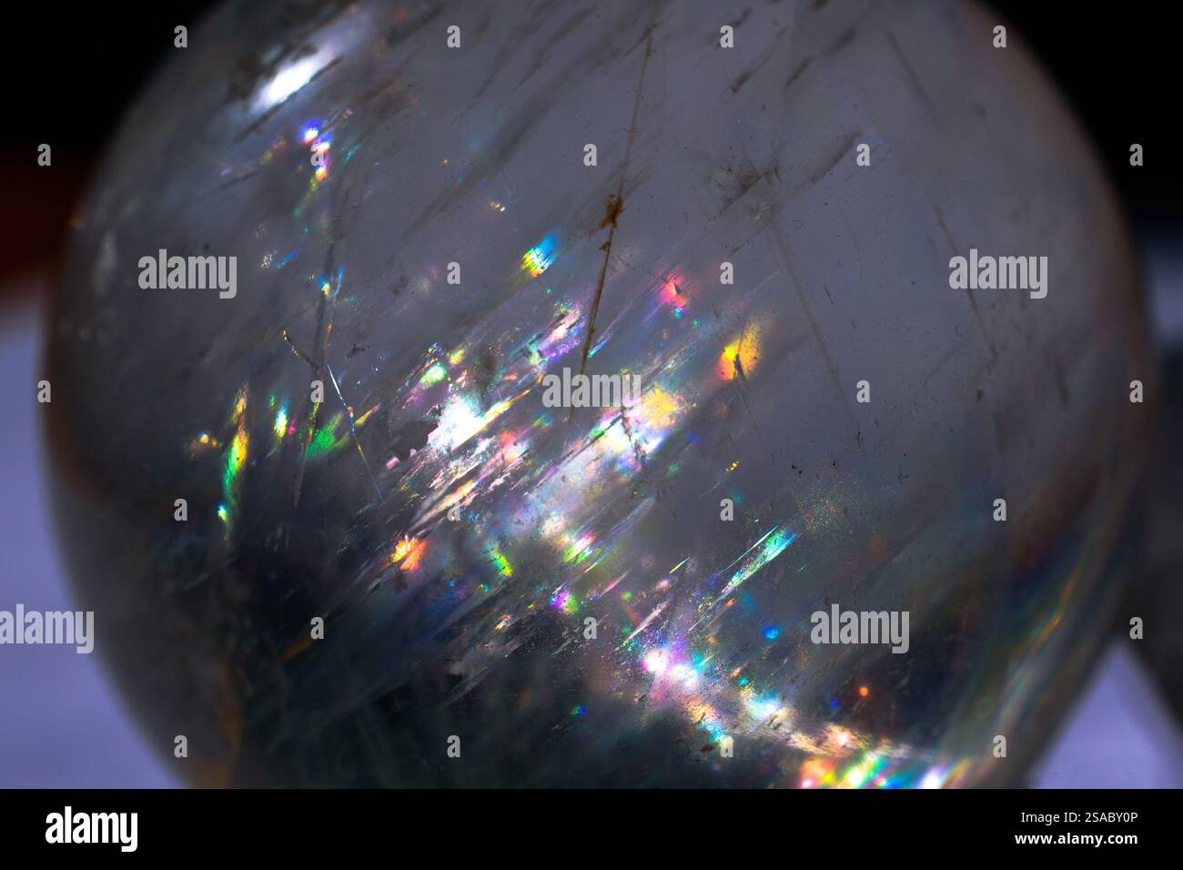 Clear Quartz Sphere with Rainbow Inclusions Stock Photo - Alamy