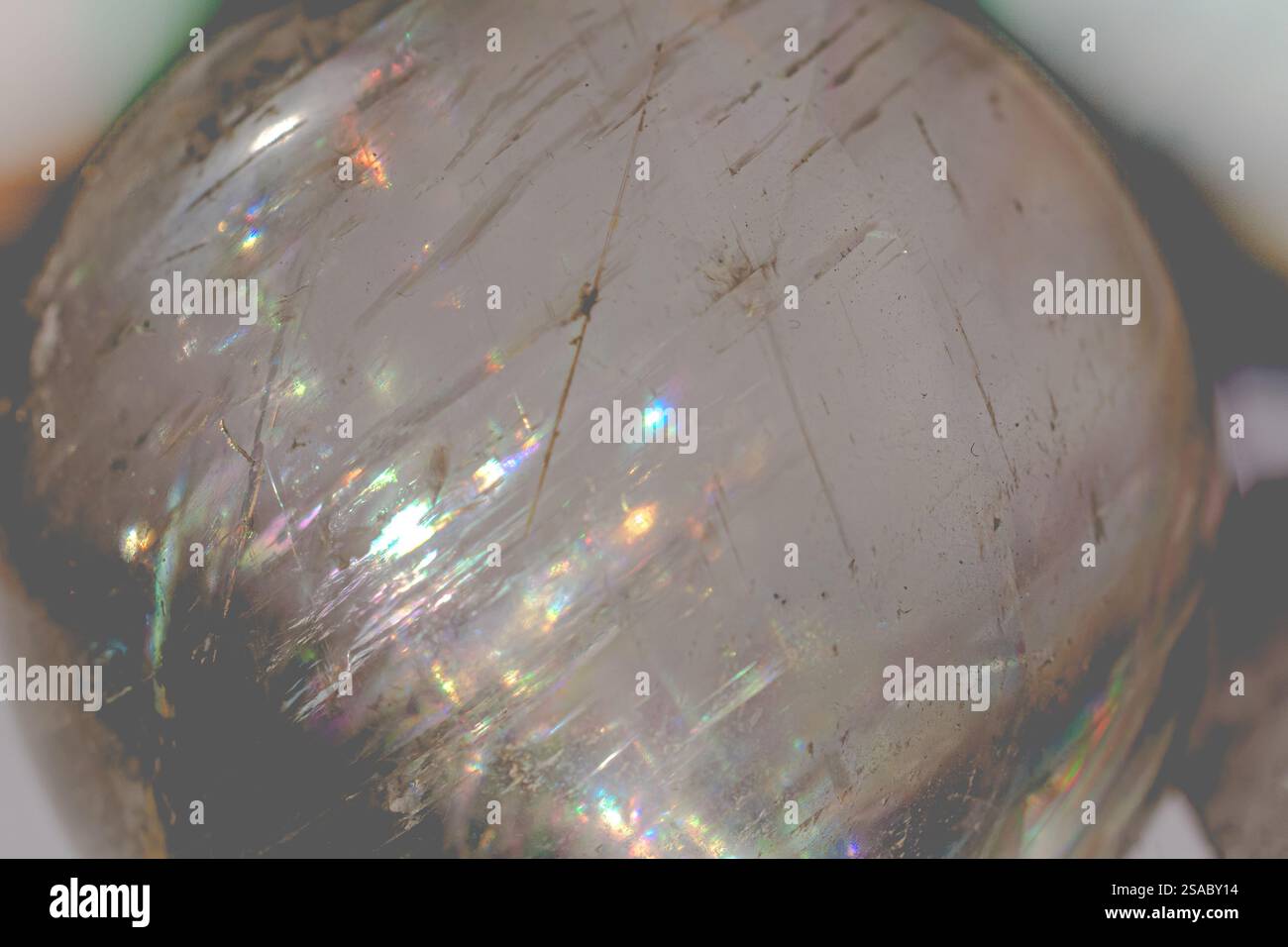 Clear Quartz Sphere with Rainbow Inclusions Stock Photo - Alamy