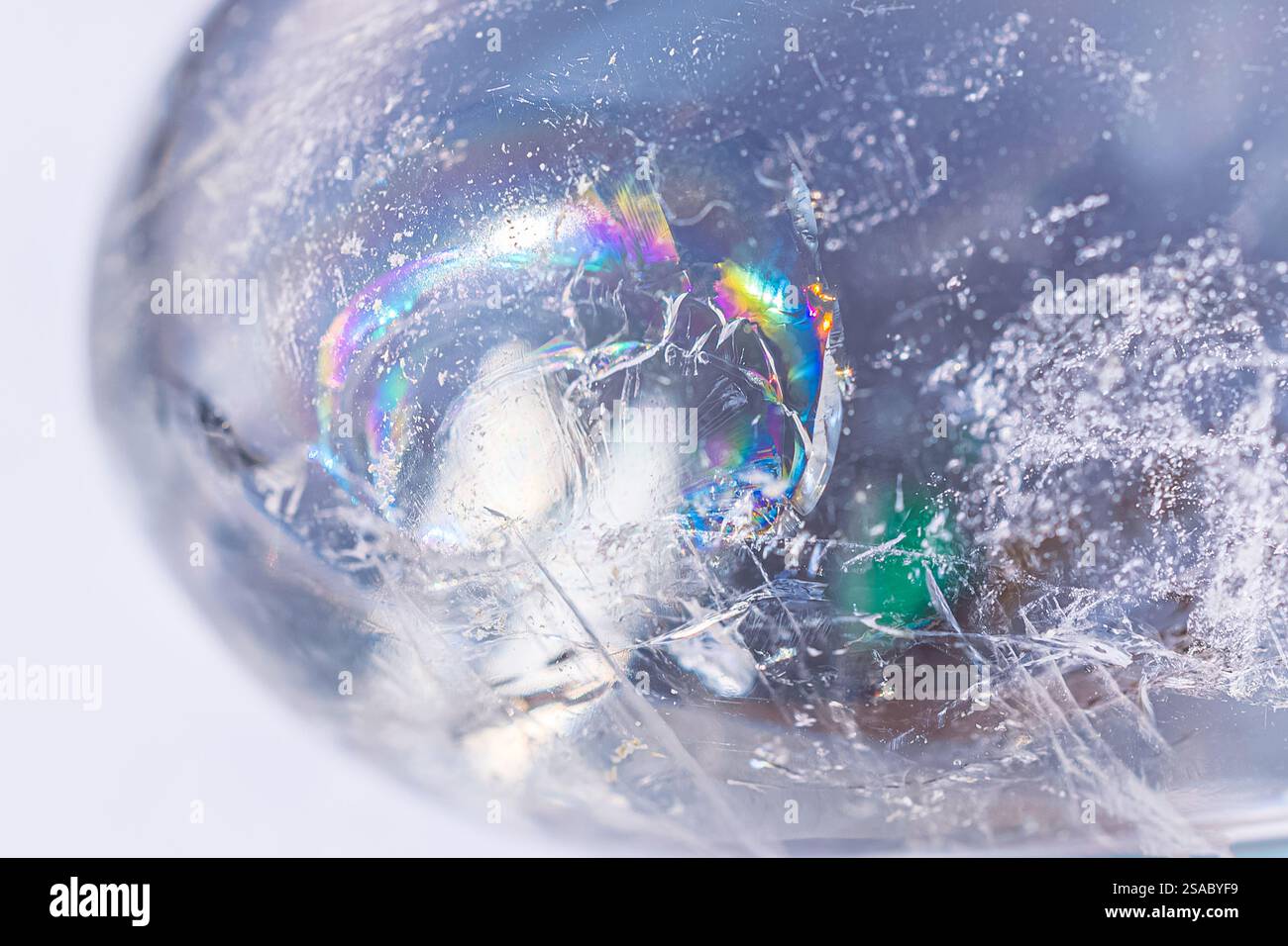 Oval Shaped Clear Quartz Crystal with Rainbow Stock Photo - Alamy