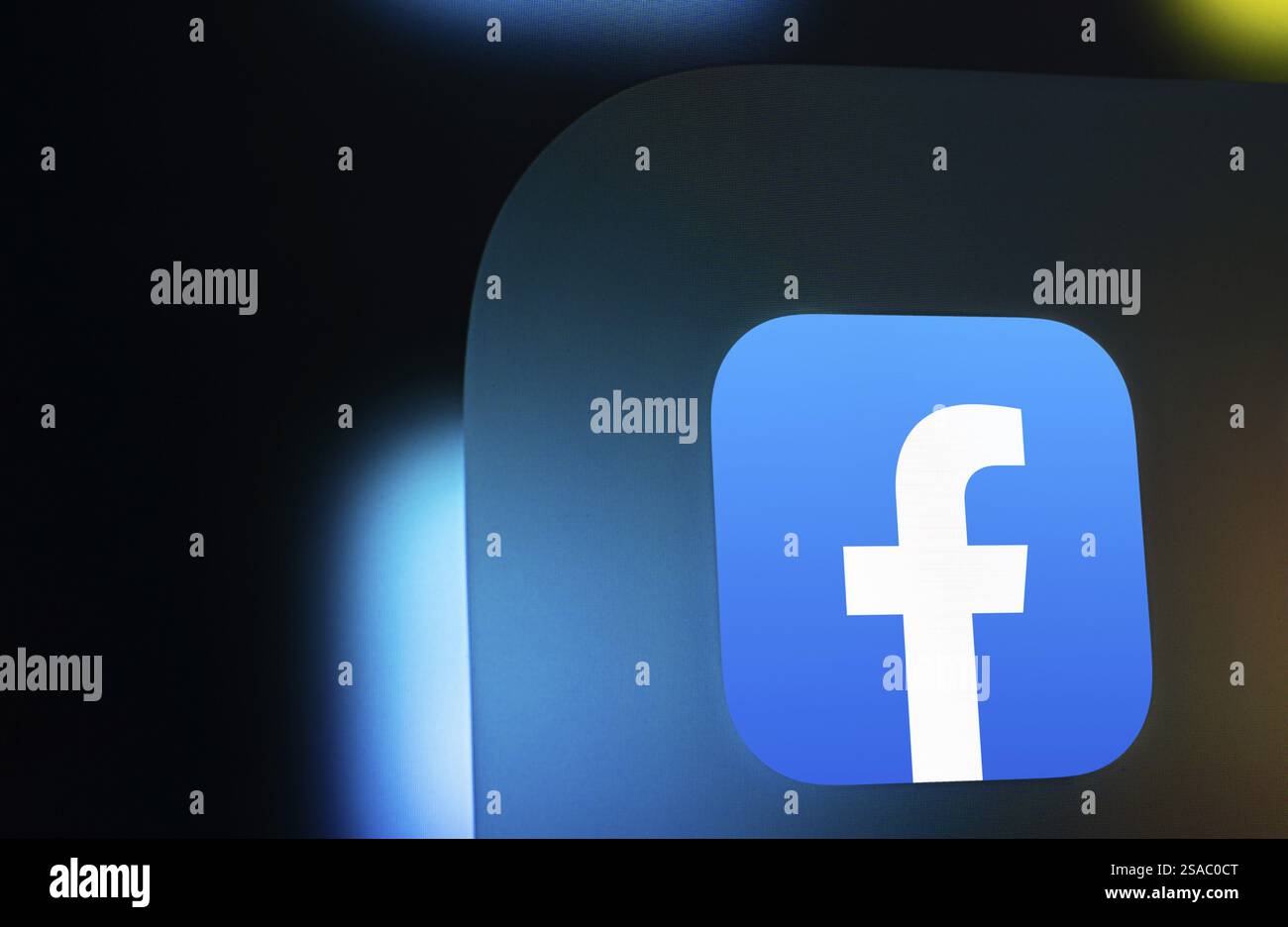 A close up of an iPad screen displaying the facebook app icon Stock ...
