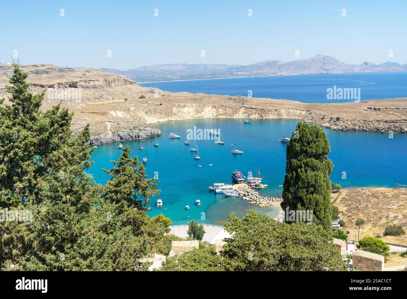 Beach of Lindos on the island of Rhodes, in the Dodecanese, Greece. Bay ...