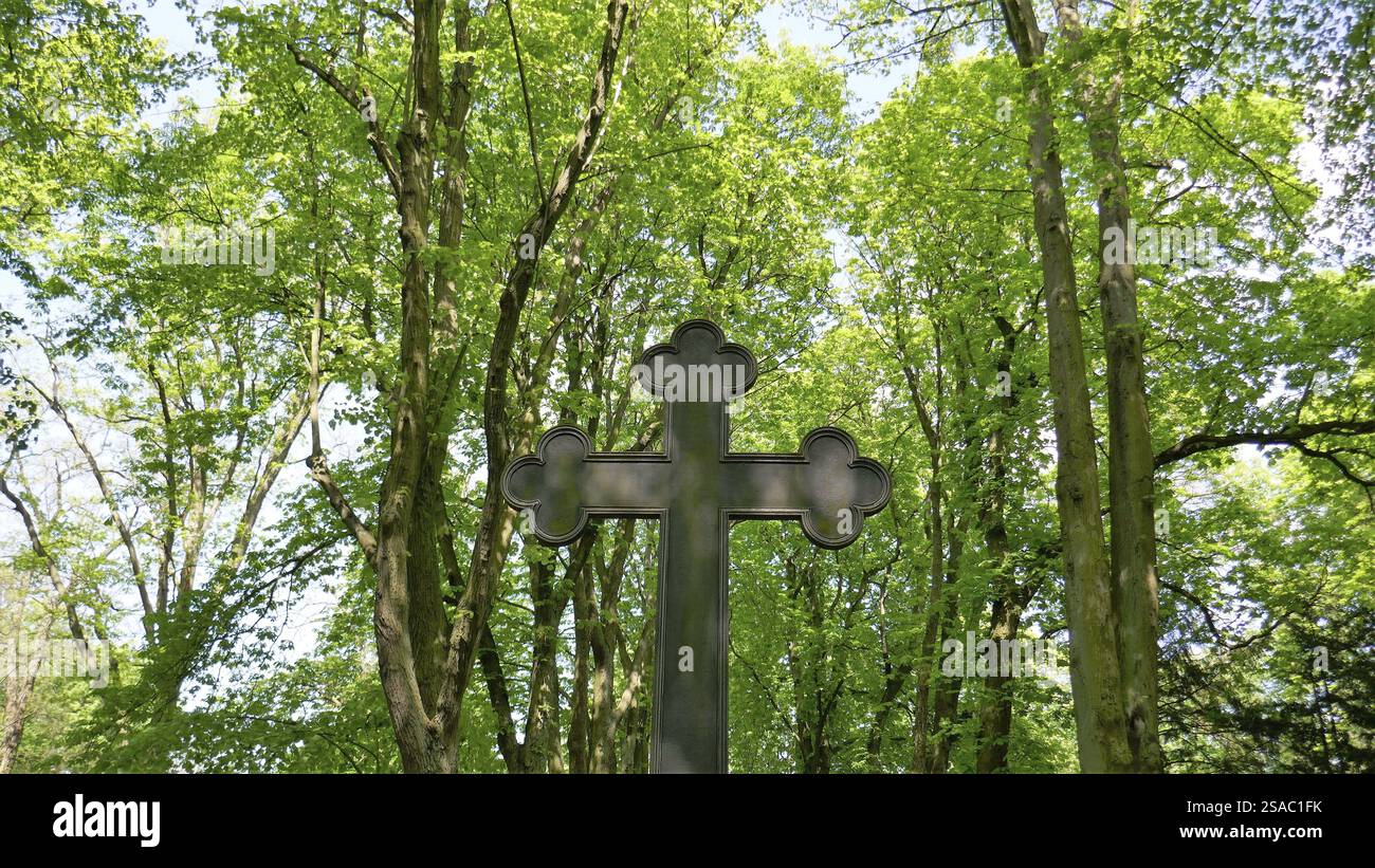 Cross under trees Stock Photo - Alamy