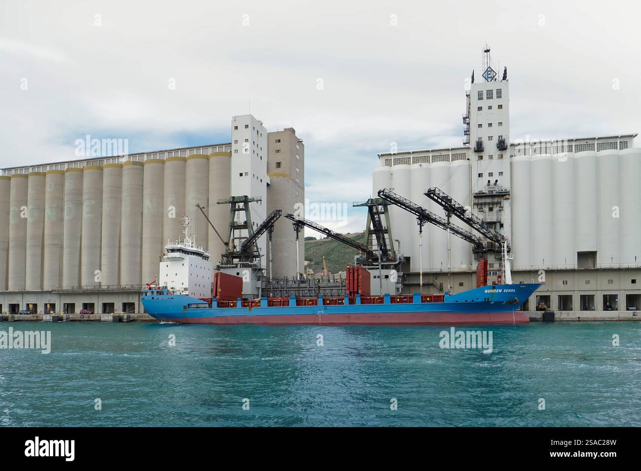 MV Gundem Serra loads bulk cargo from silos in port at Barcelona ...