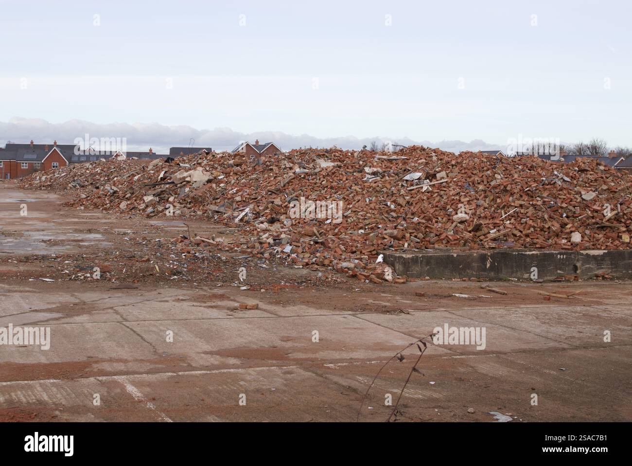 A huge pile of bricks and rubble remain after the demolition of the ...