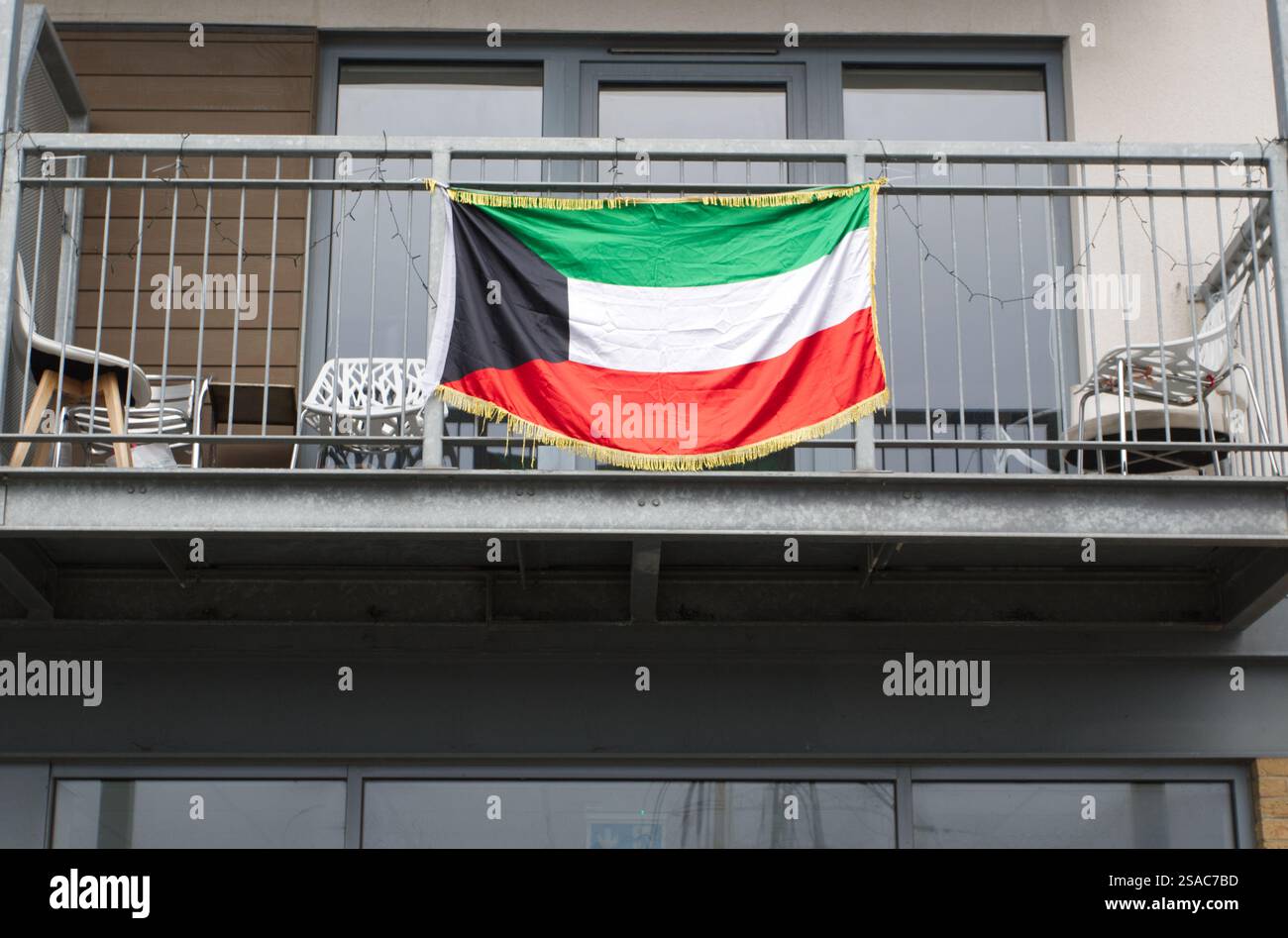 The flag of Kuwait, a country in the Middle East, is tied to and ...