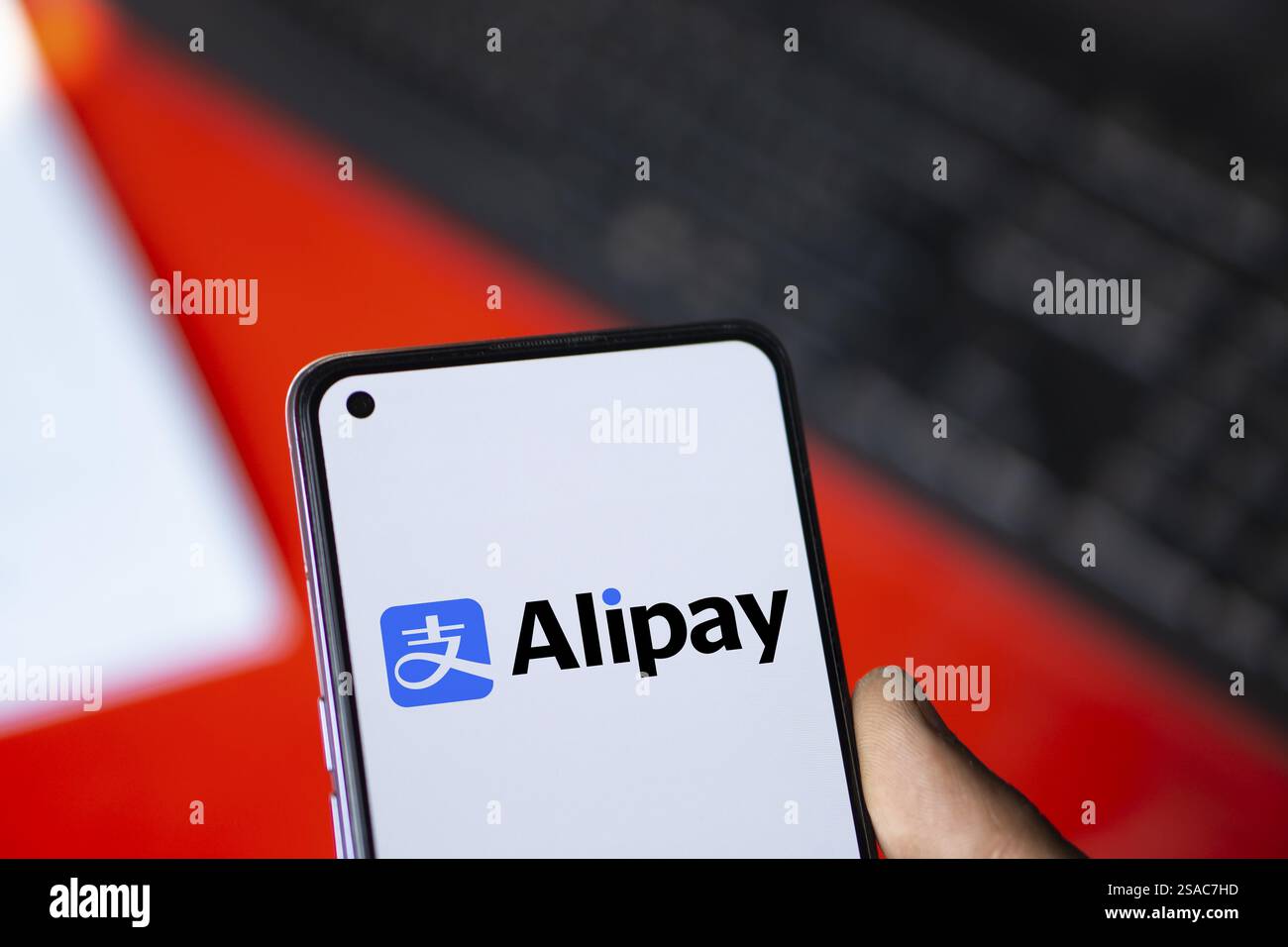 Alipay logo is displayed on smartphone. Alipay is a online payment ...