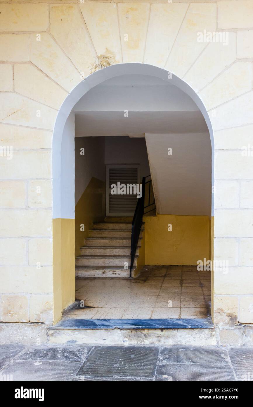 Indoor Stairwell With Metal Railing and Yellow Painted Walls Stock ...