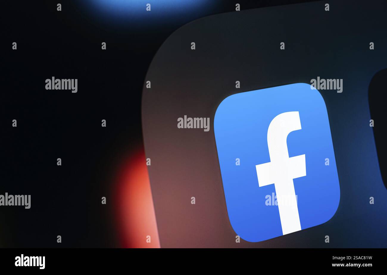 A close up of an iPad screen displaying the facebook app icon Stock ...