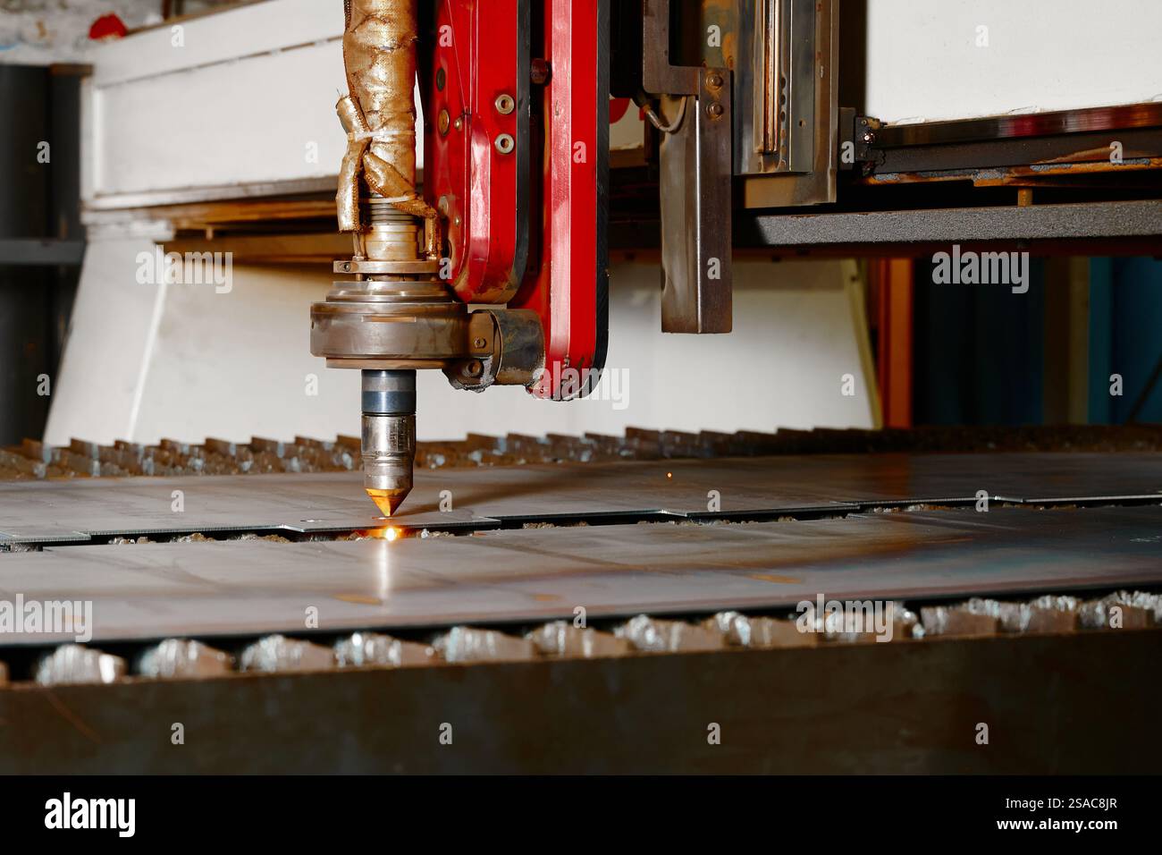 Plasma cutting of metal sheet with machine tool in workshop Stock Photo ...