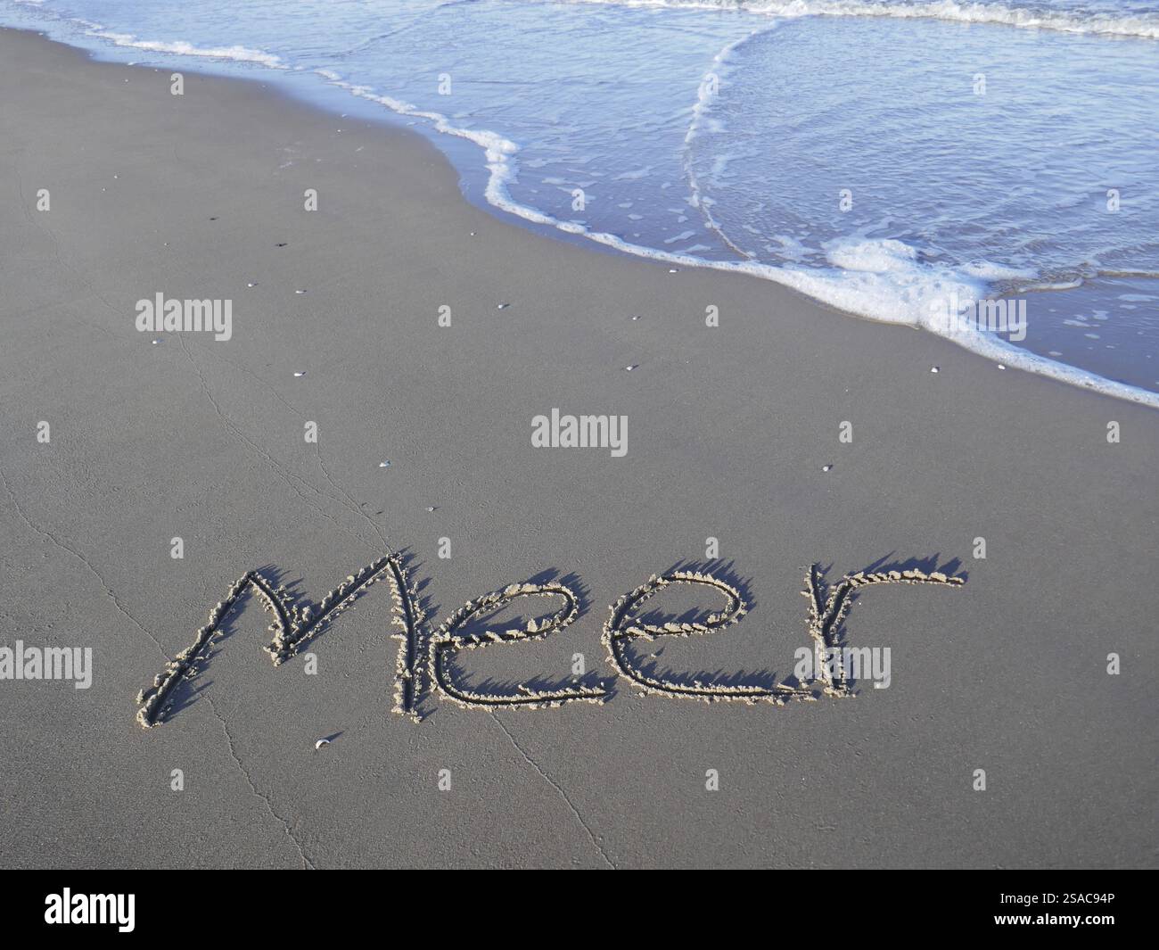 Sea written in the sand Stock Photo - Alamy