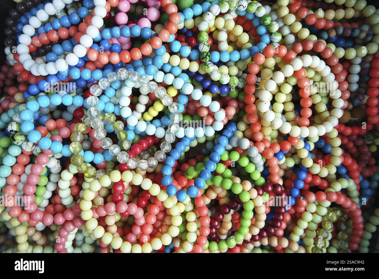 Numerous bracelets hi-res stock photography and images - Alamy