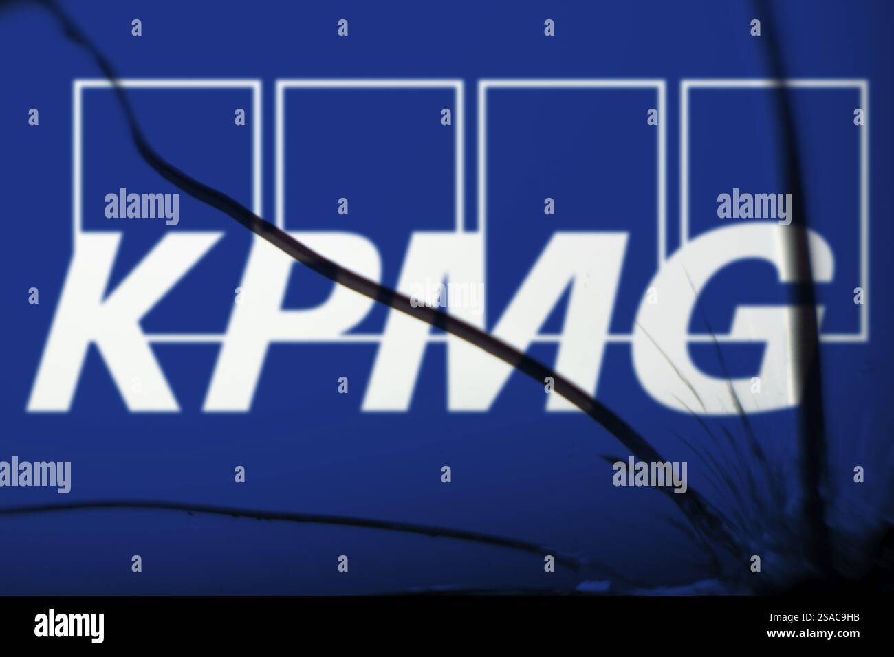 kpmg logo is visible on the broken glass. KPMG International Limited is ...