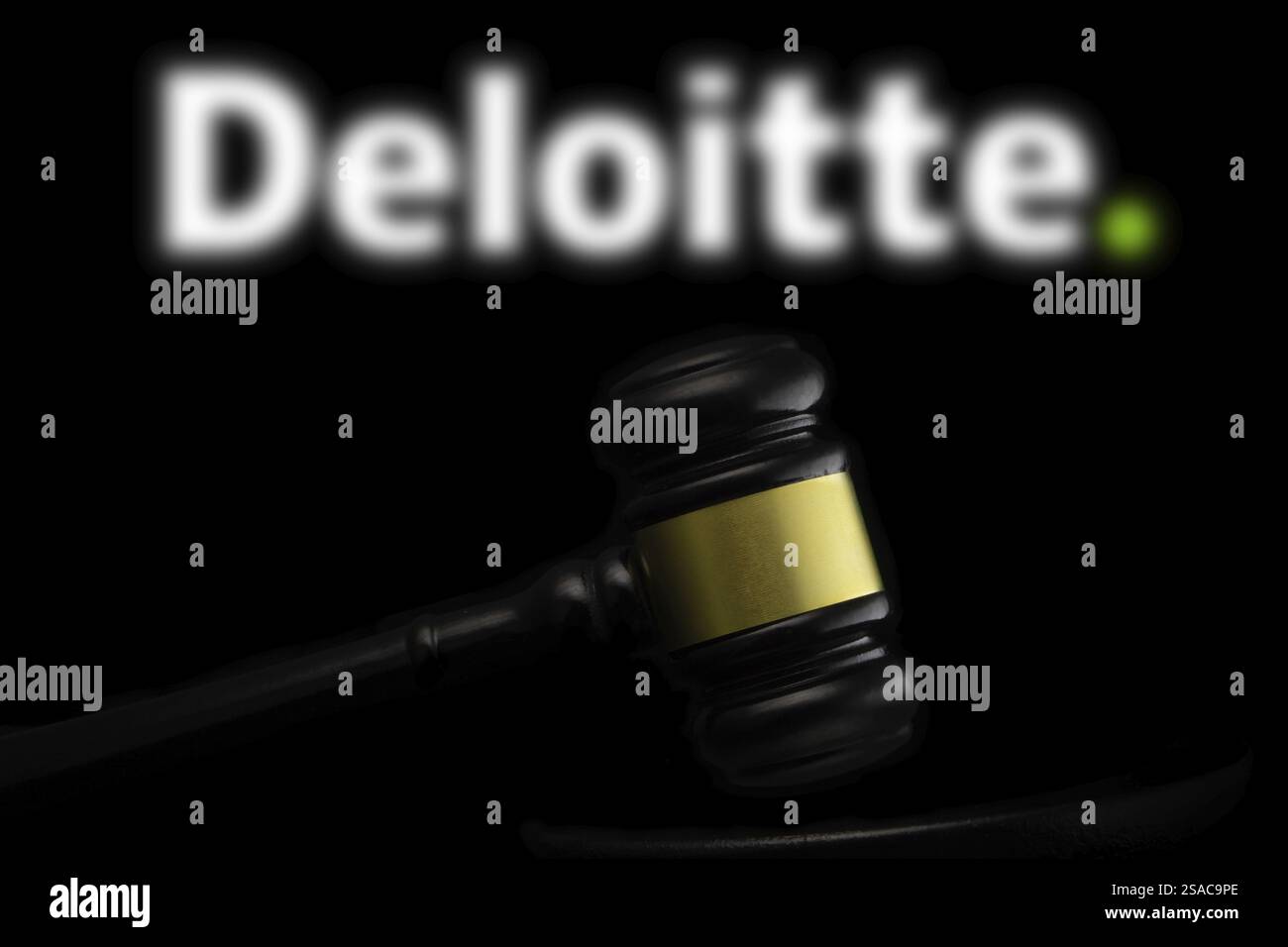 Court gavel in front of the Deloitte logo. Deloitte is a multinational ...