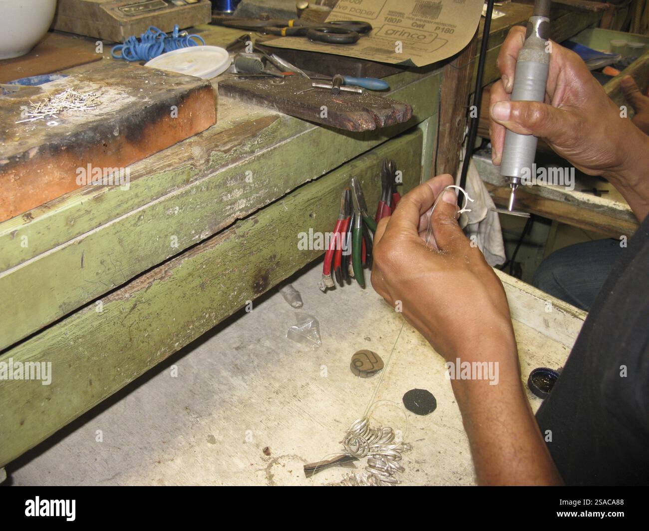 Jewellery manufacture, silver processing Stock Photo - Alamy