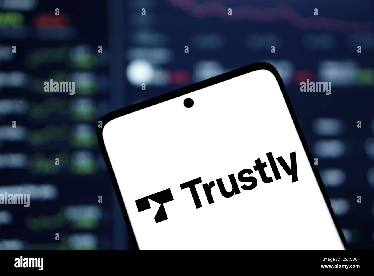 Trustly logo is displayed on smartphone. Trustly AB is a Swedish ...