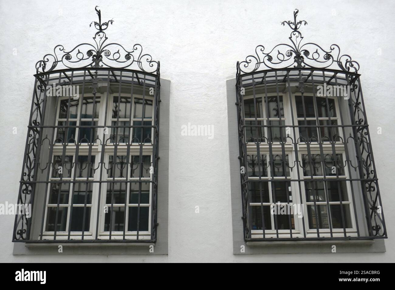 Two barred windows Stock Photo - Alamy