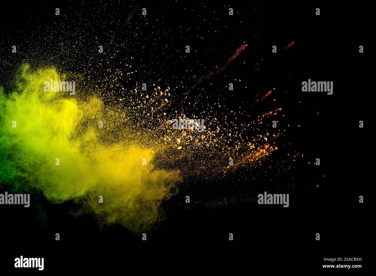 Colorful explosion of powdery dust is captured in a yellow and green ...