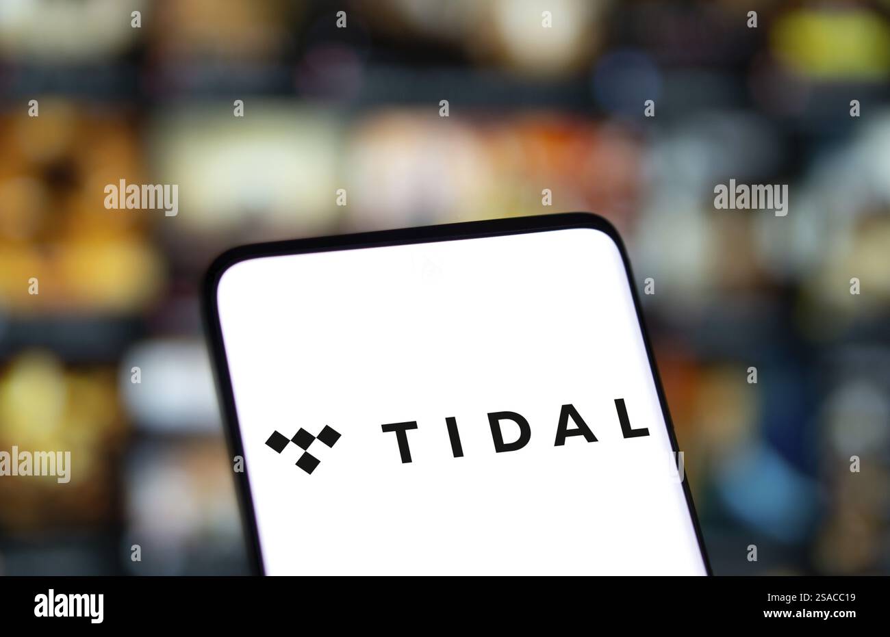 Tidal logo is displayed on smartphone. Tidal is a Norwegian-American ...