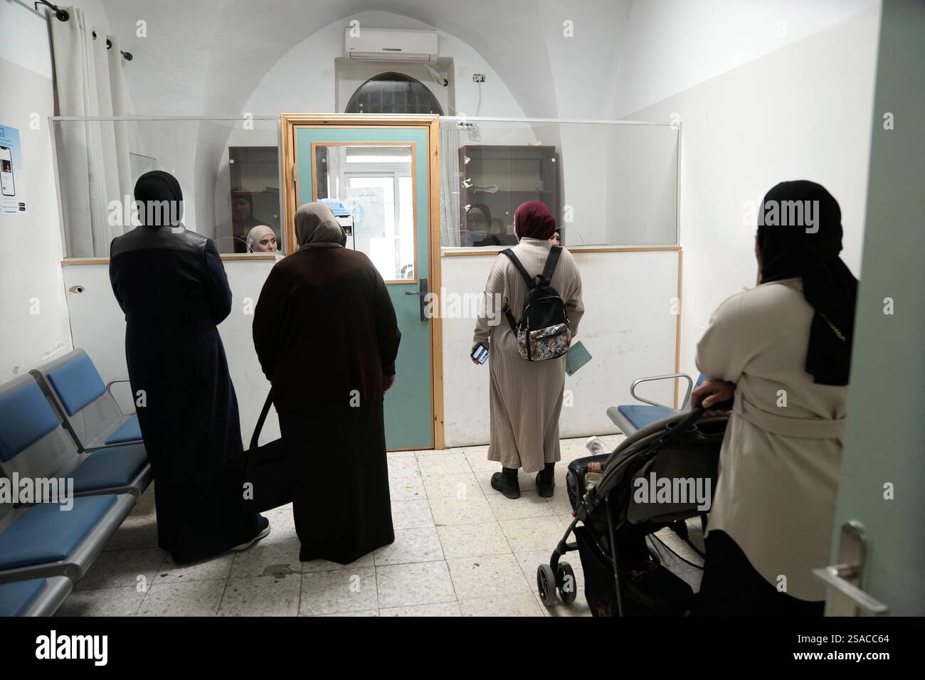 Women wait to be served at a health clinic run by the United Nations ...