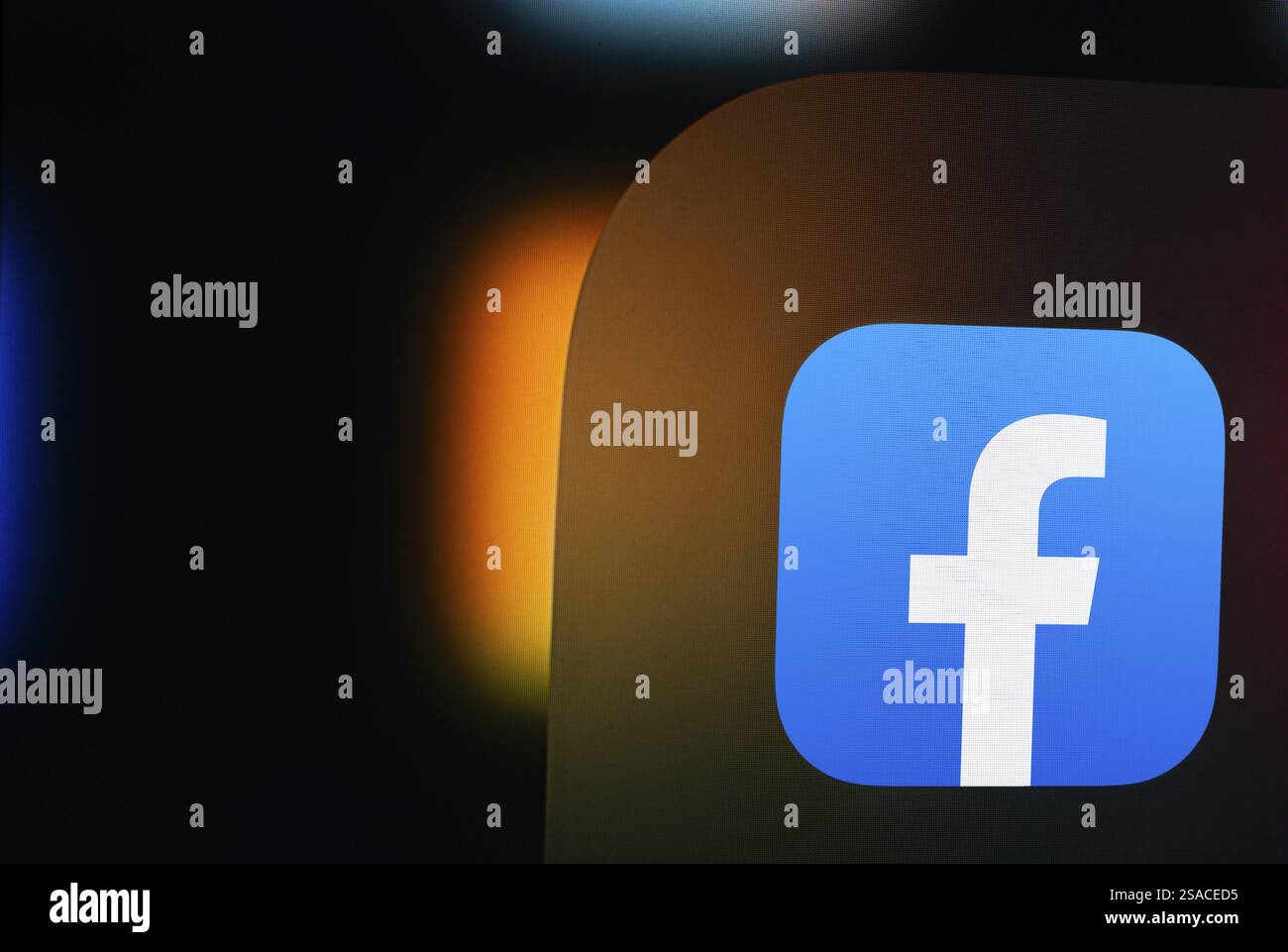 A close up of an iPad screen displaying the facebook app icon Stock ...