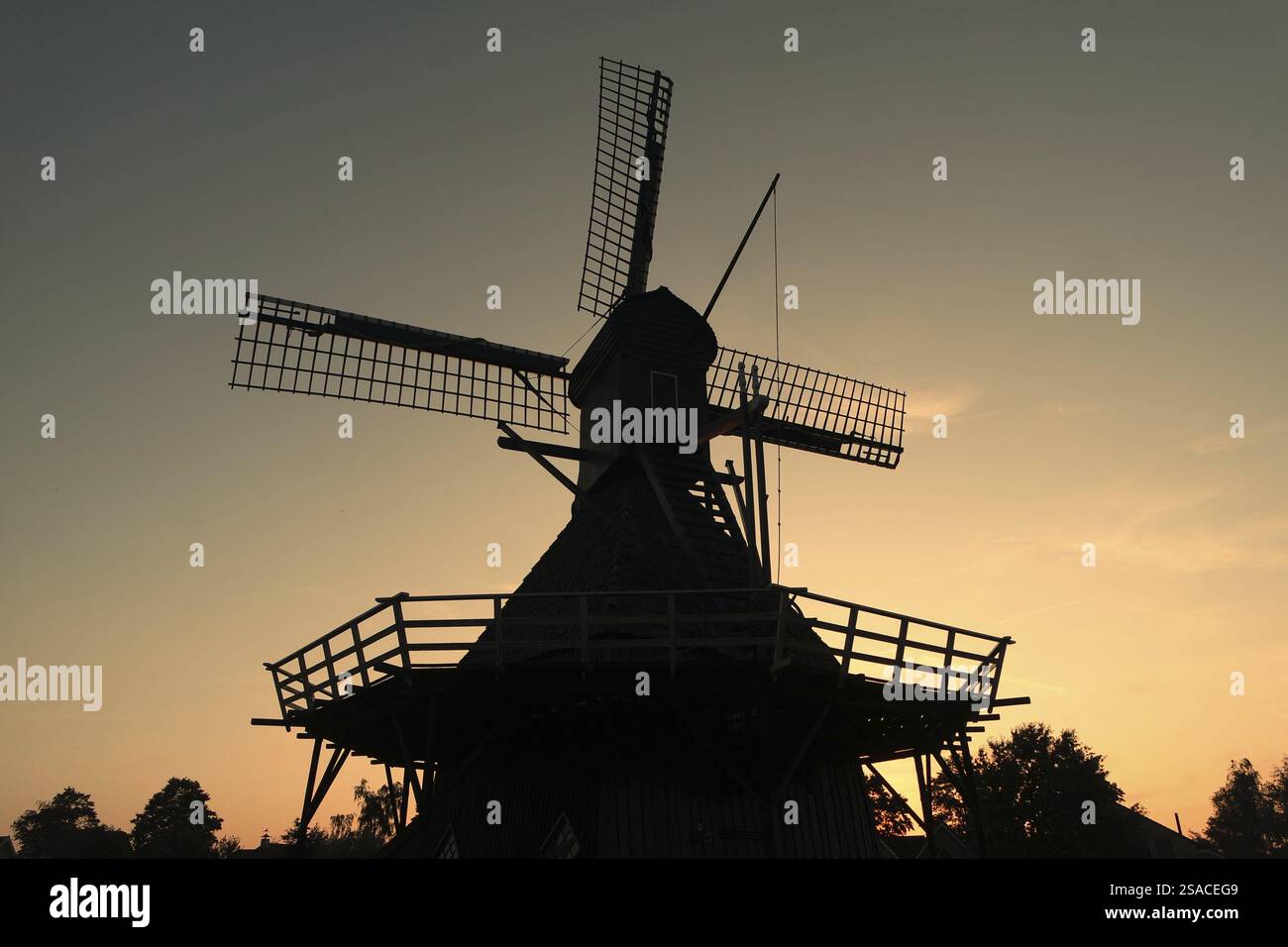 Silhouette windmill at sunset. Friesland Stock Photo - Alamy