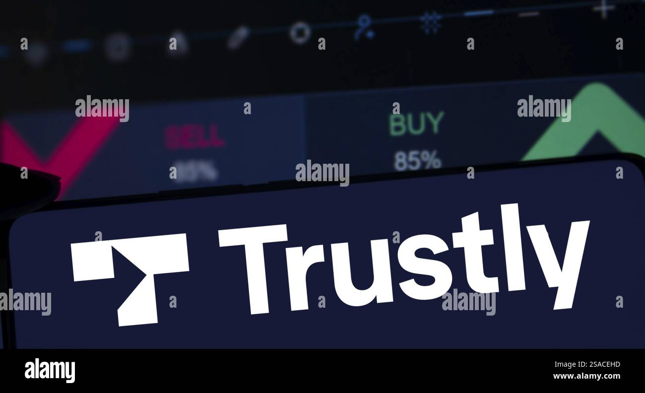 Trustly logo is displayed on smartphone. Trustly AB is a Swedish ...