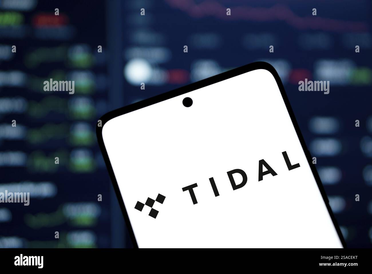 Tidal logo is displayed on smartphone. Tidal is a Norwegian-American ...