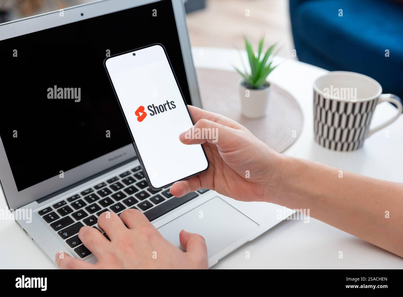 Wroclaw, Poland - JAN 17, 2025: Man holding device with YouTube Shorts ...
