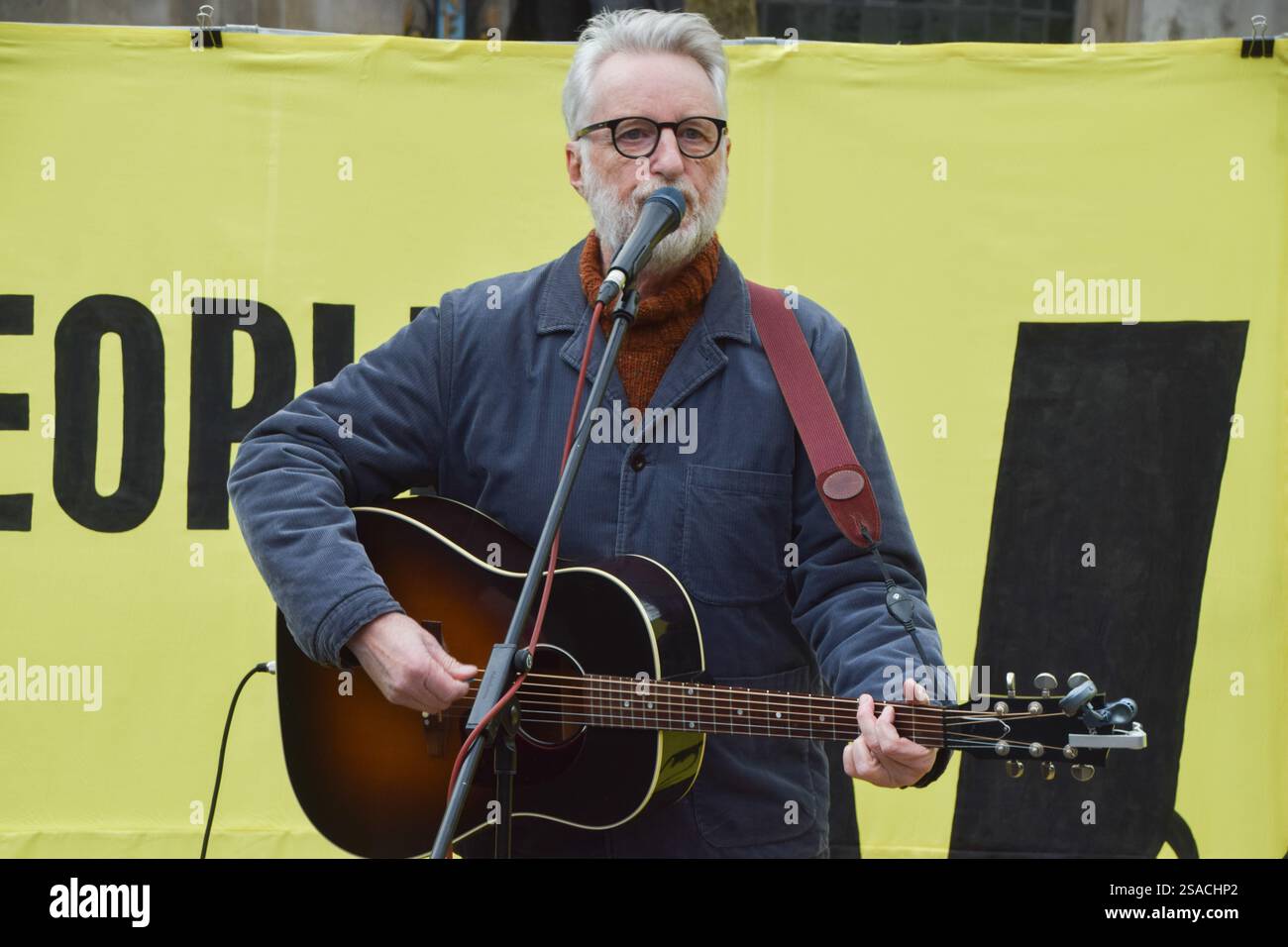 Singer-songwriter Billy Bragg performs during the demonstration ...