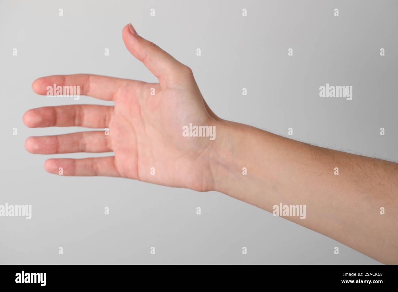 Woman with visible hand veins on light grey background, closeup Stock Photo - Alamy
