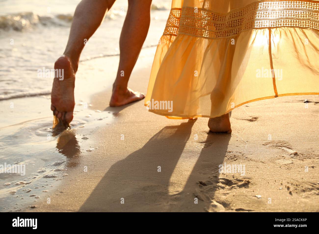 Female legs walking on beach hi-res stock photography and images - Alamy