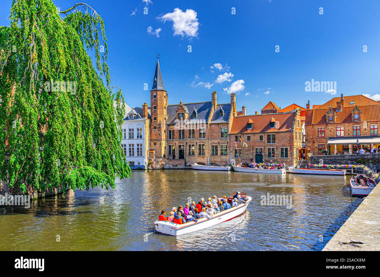 Bruges, Belgium, July 5, 2023: tourists boat in Dijver water canal of ...