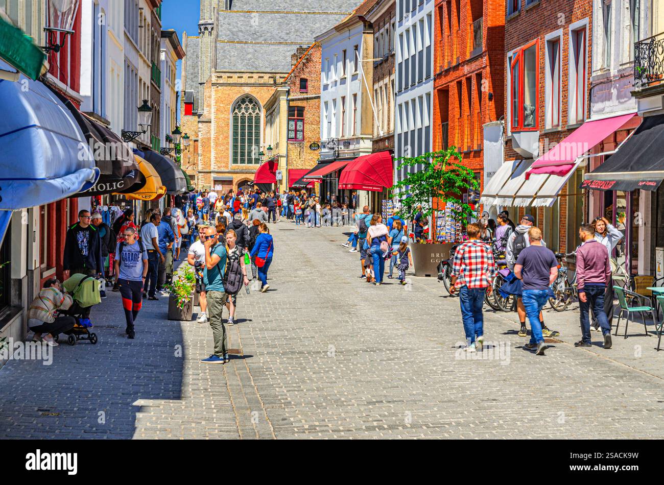 Bruges, Belgium, July 5, 2023: crowd of people walking down pedestrian ...