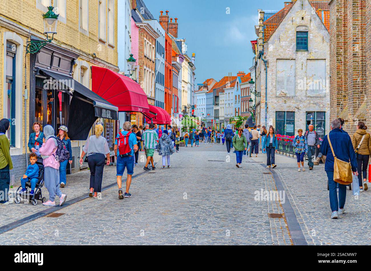 Bruges, Belgium, July 5, 2023:people tourists walking down pedestrian ...