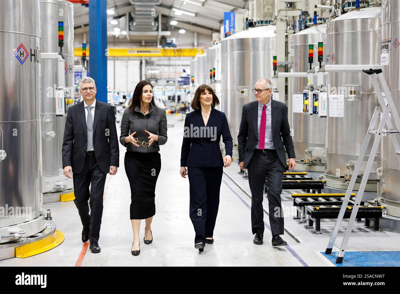 Chancellor Rachel Reeves walks with (left to right) Managing Director ...