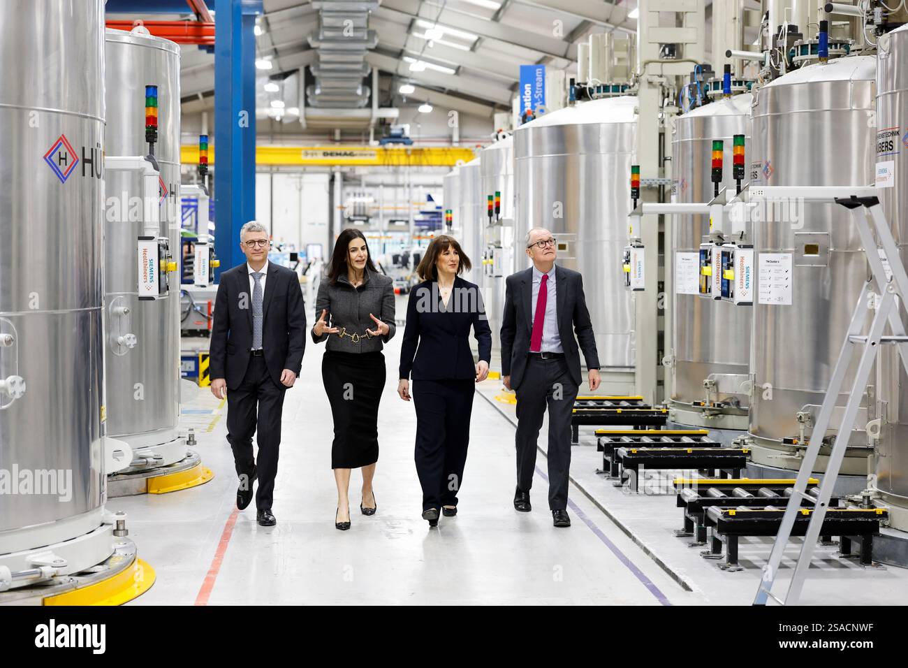 Chancellor Rachel Reeves walks with (left to right) Managing Director ...