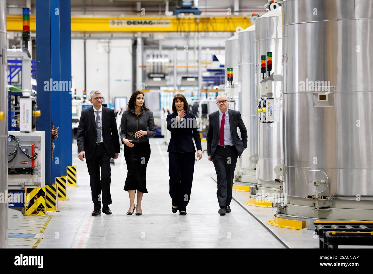 Chancellor Rachel Reeves walks with (left to right) Managing Director ...