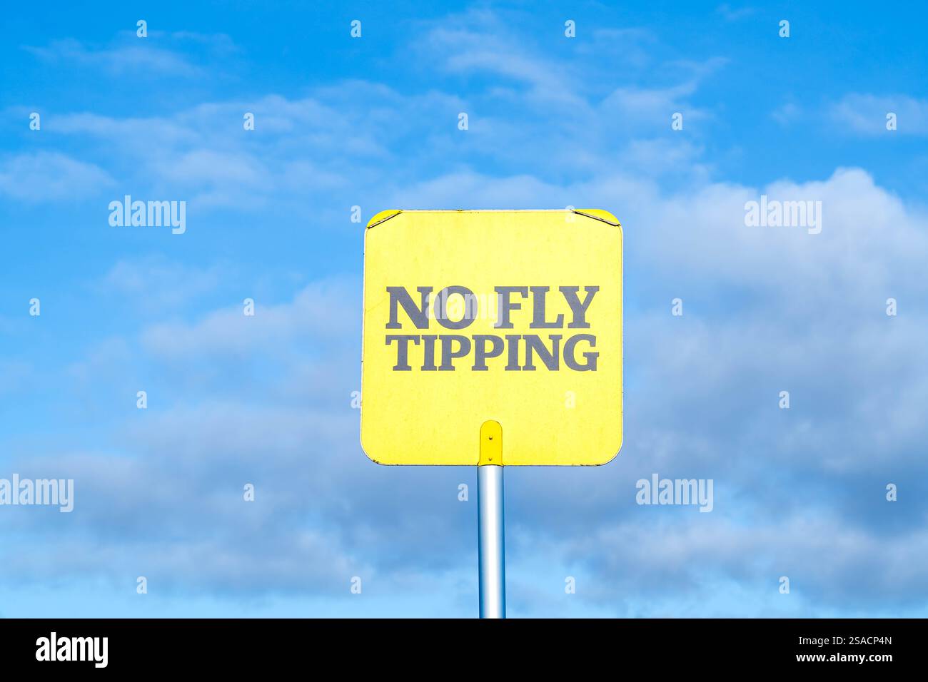 Yellow "No fly tipping" sign, no illegal dumping due to health and ...