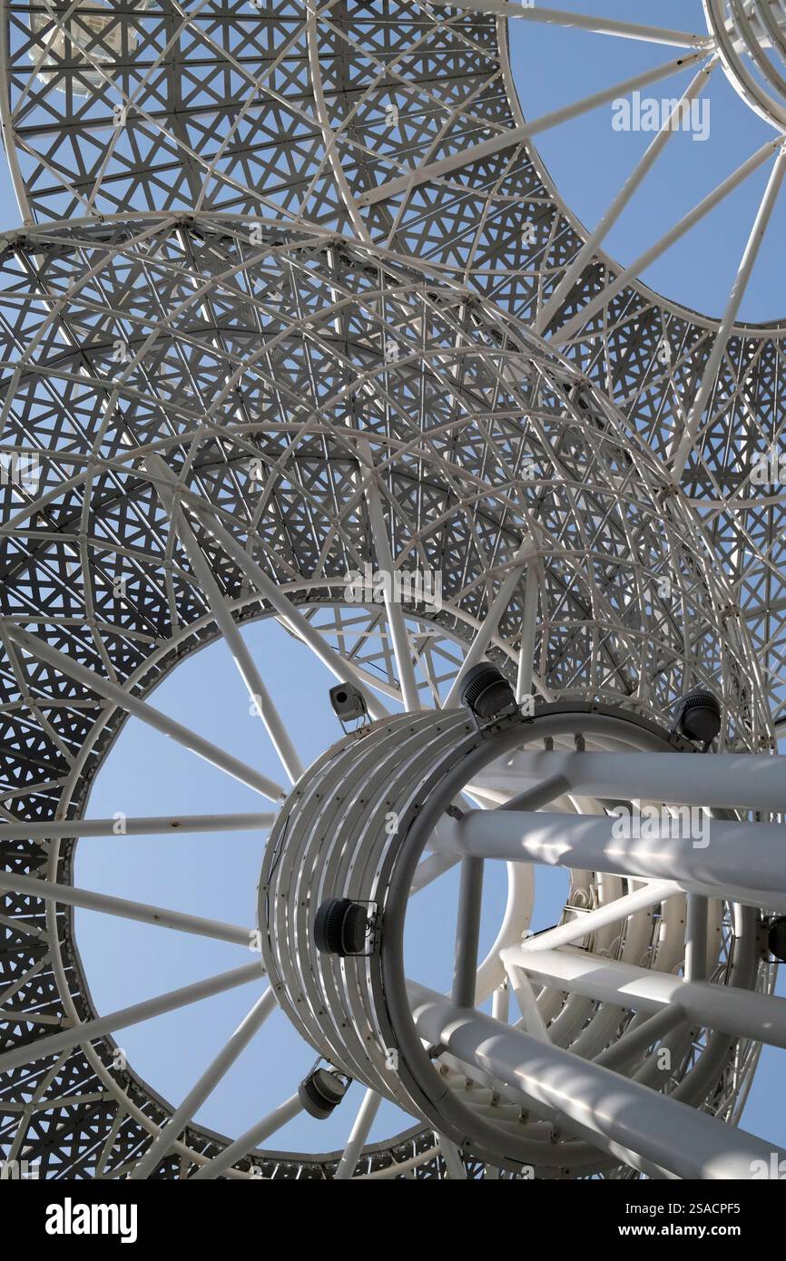 Modern artificial tree constructions and shopping street on Dubai ...