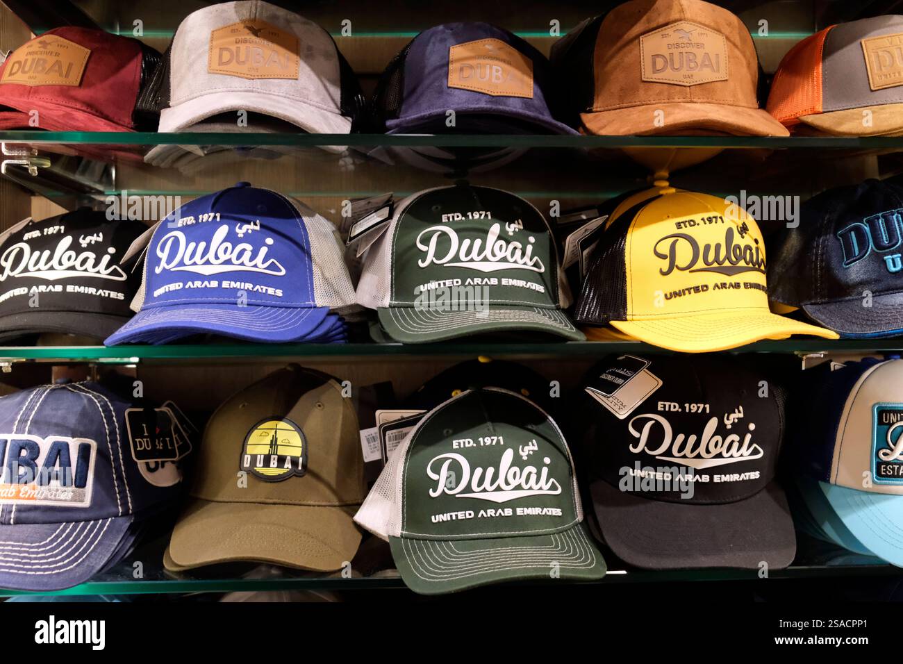 Souvenir shop in the Deira souk. Caps with the Dubai logo. Dubai, UAE ...