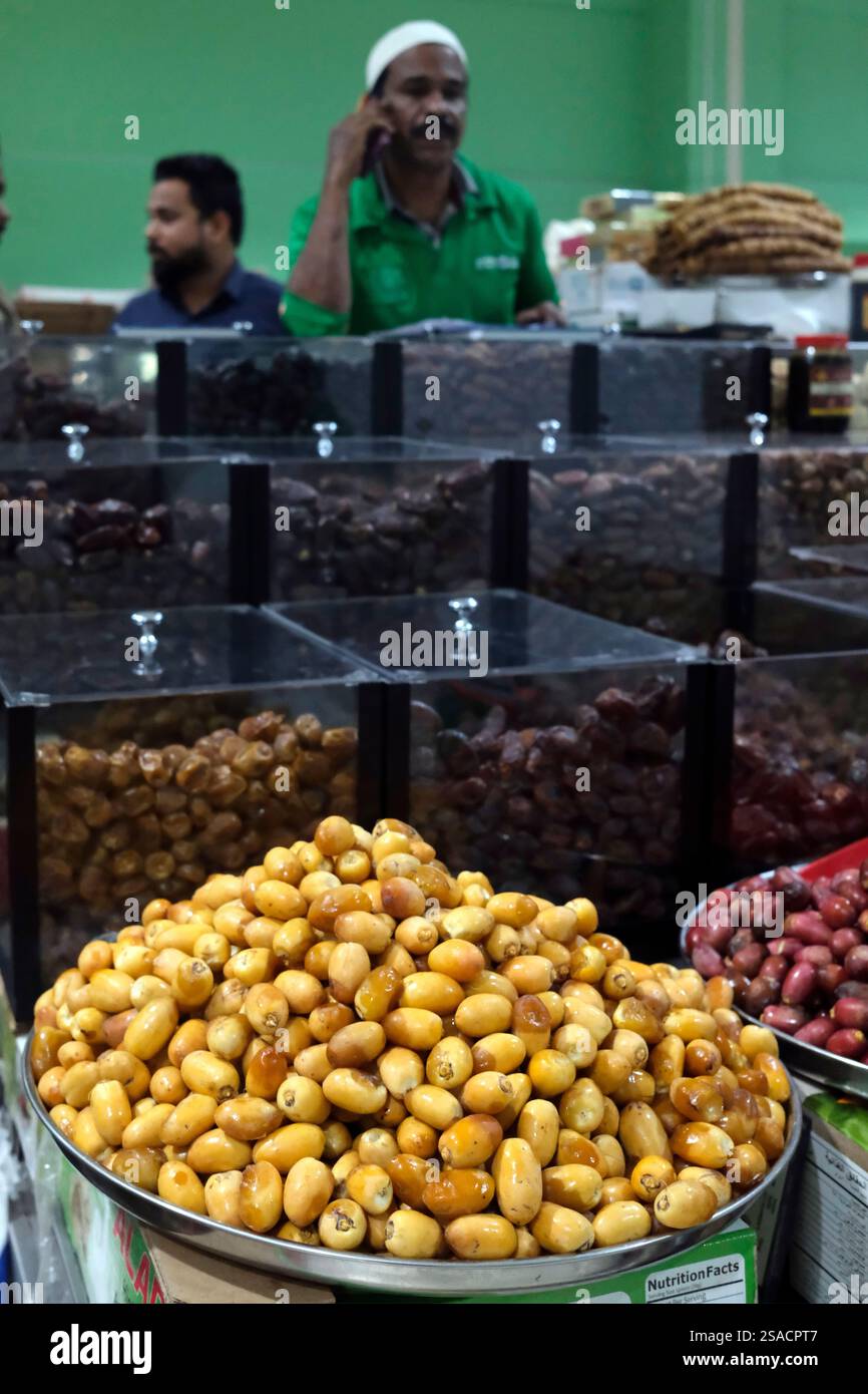 Date seller at market. Dates are very juicy and sweet, healthy and full ...