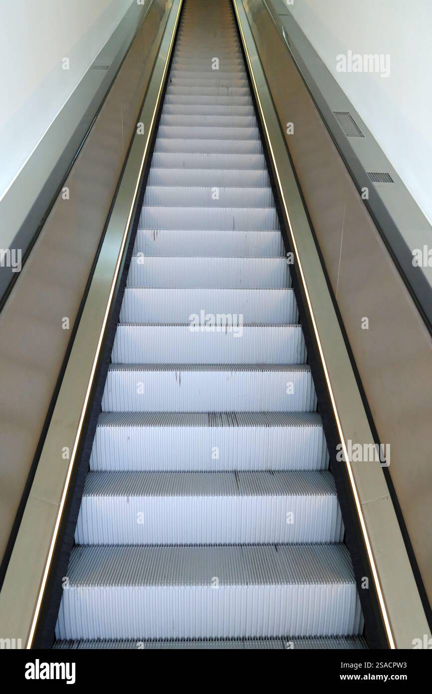 Empty electric escalator. Perspective and symmetry concept. Regensburg ...