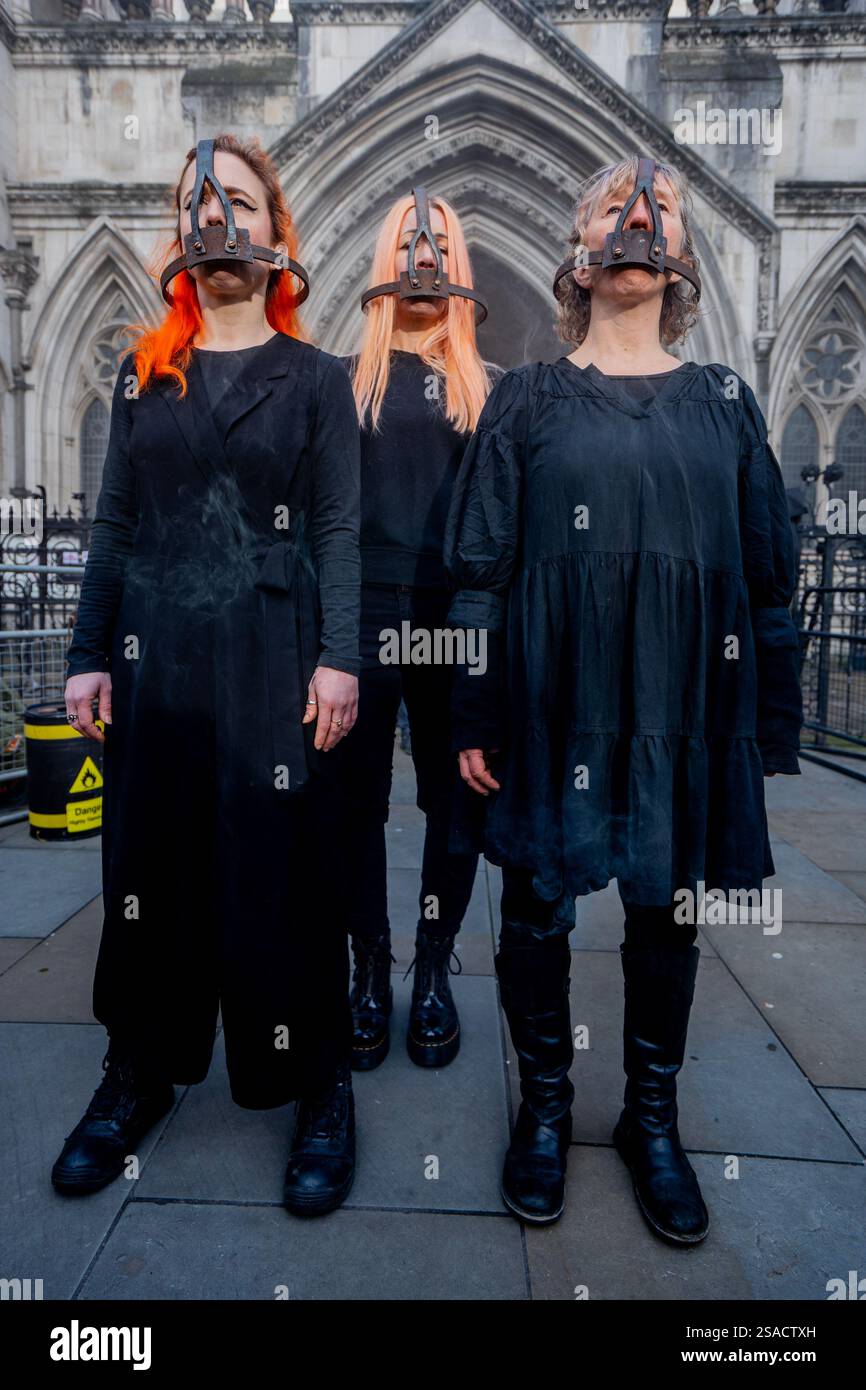 London, UK. 29th Jan, 2025. Climate campaigners wearing gags over their ...