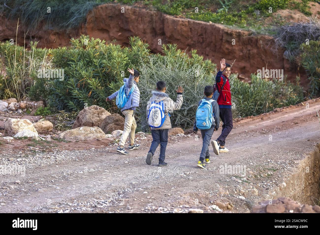 School boys waving near Tazert, Morocco Stock Photo - Alamy