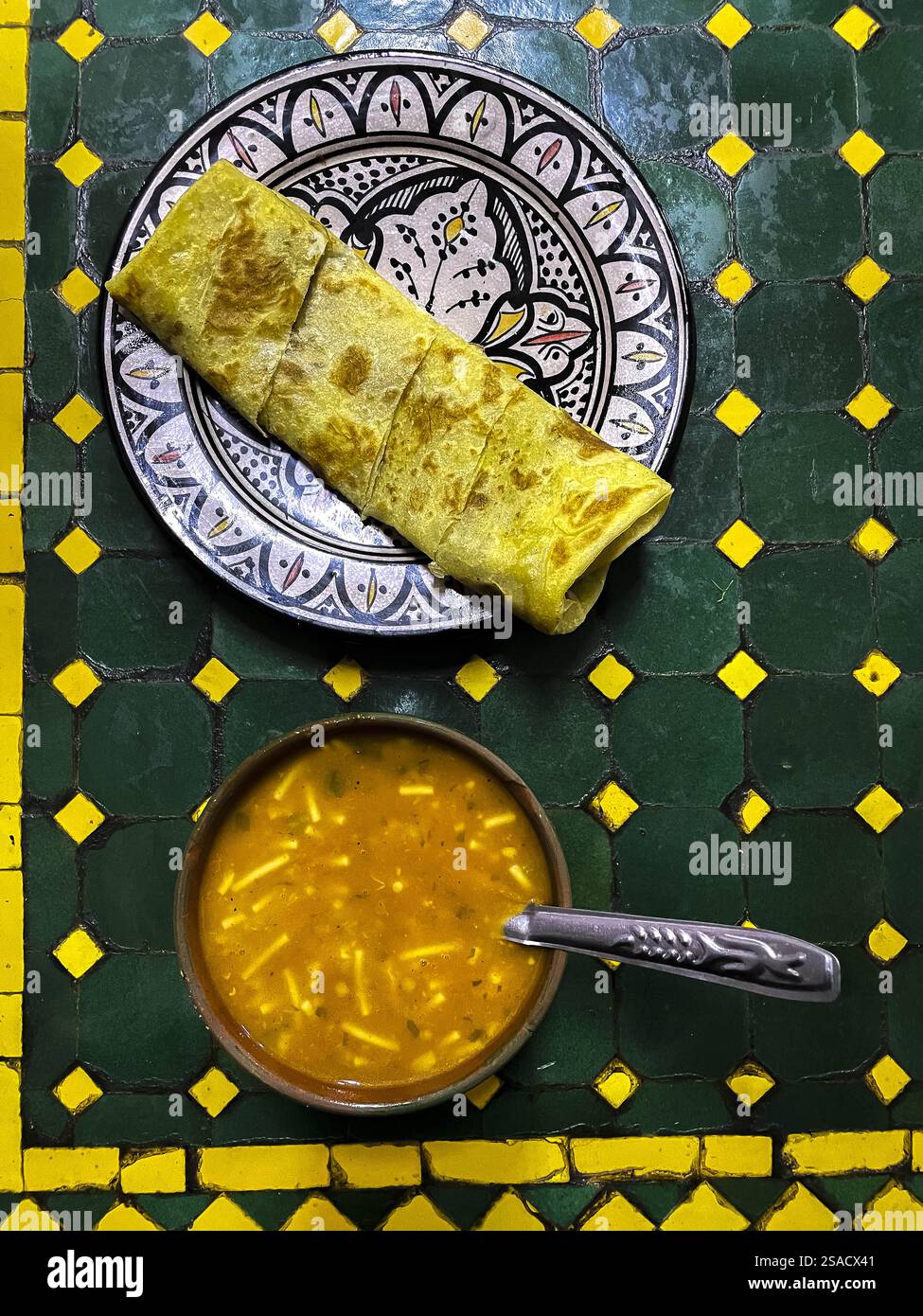Soup and melaoui pancake and served in a small restaurant in Marrakesh ...