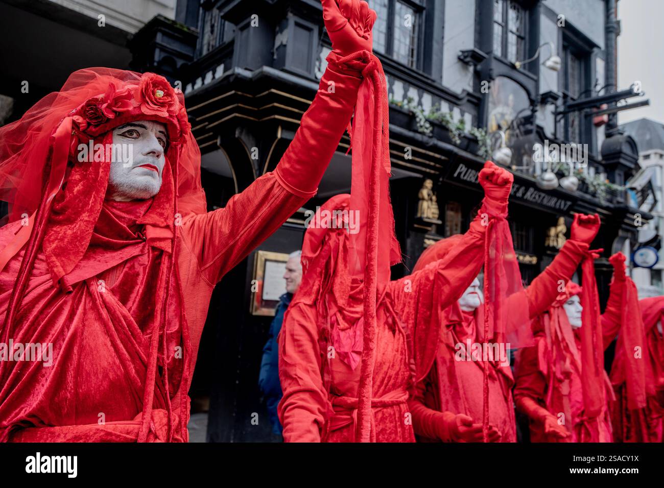 London, UK. 29th Jan, 2025. Red rebels perform outside the Crown Court ...
