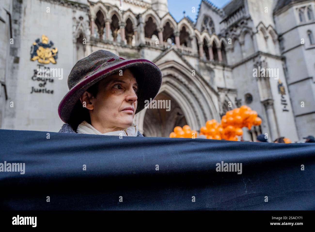 A climate change campaigner stands outside the Crown Court on the first ...