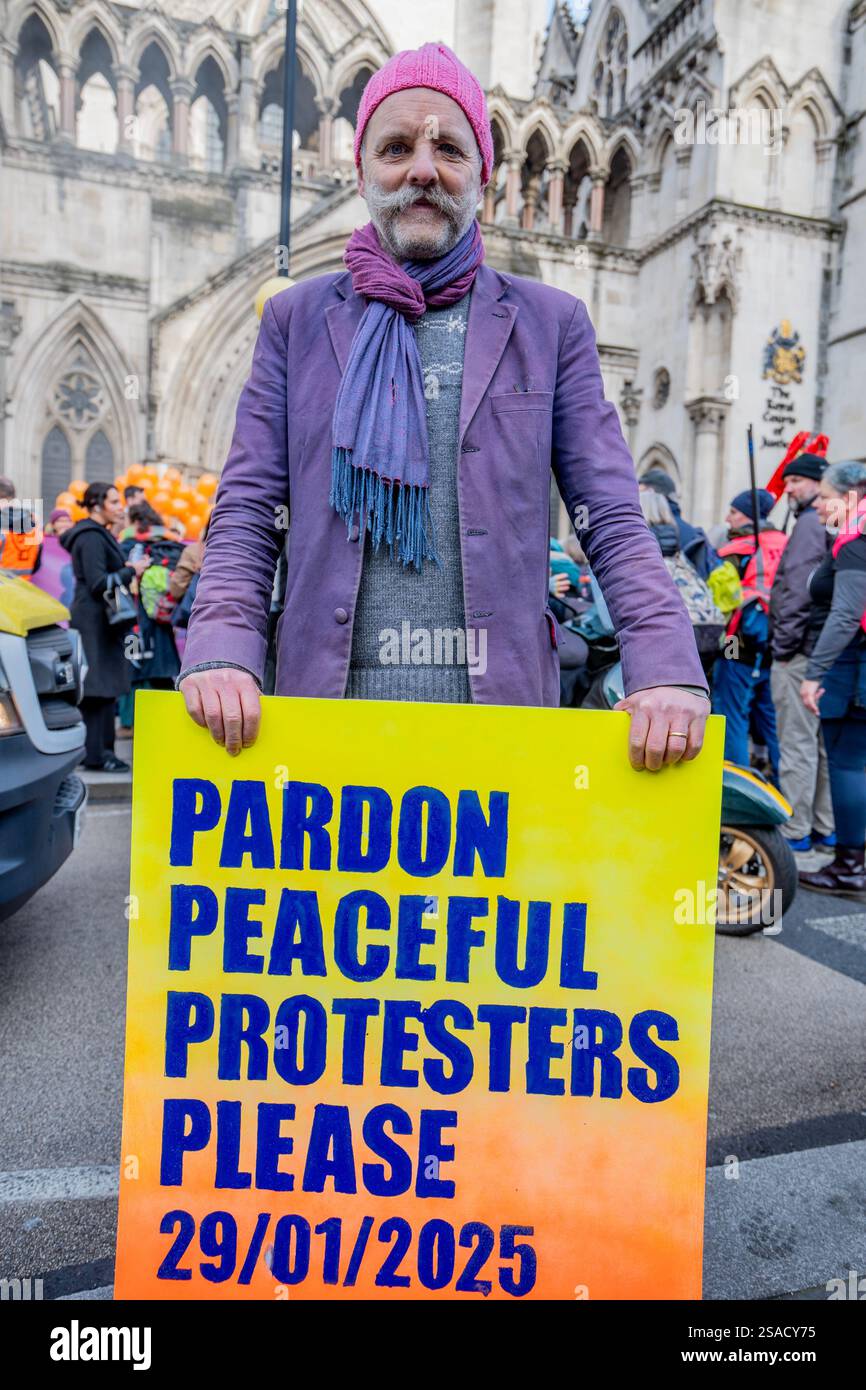 Artist Gavin Turk holds a placard during the demonstration. The Court ...