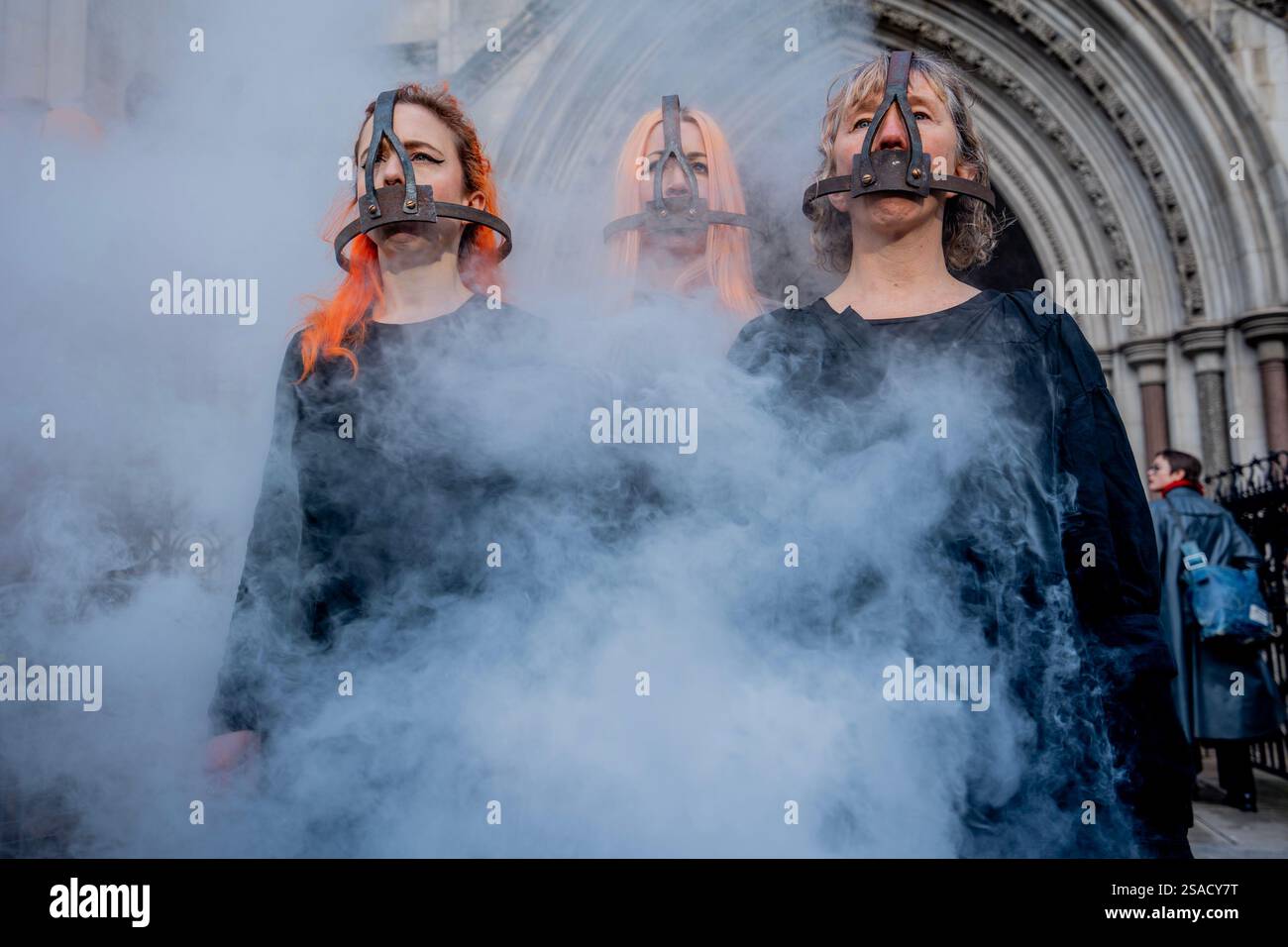 London, UK. 29th Jan, 2025. Climate campaigners wearing gags over their ...