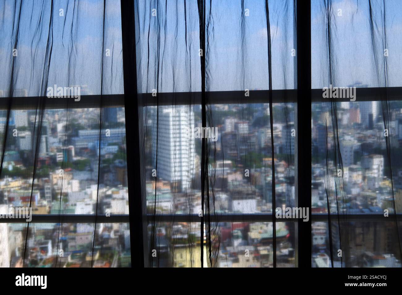 Ho Chi Minh city (or Saigon) skyline with colorful house. Saigon is the ...